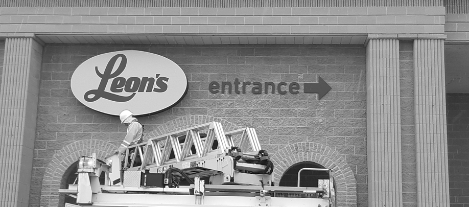 About Us, That Sign Guy